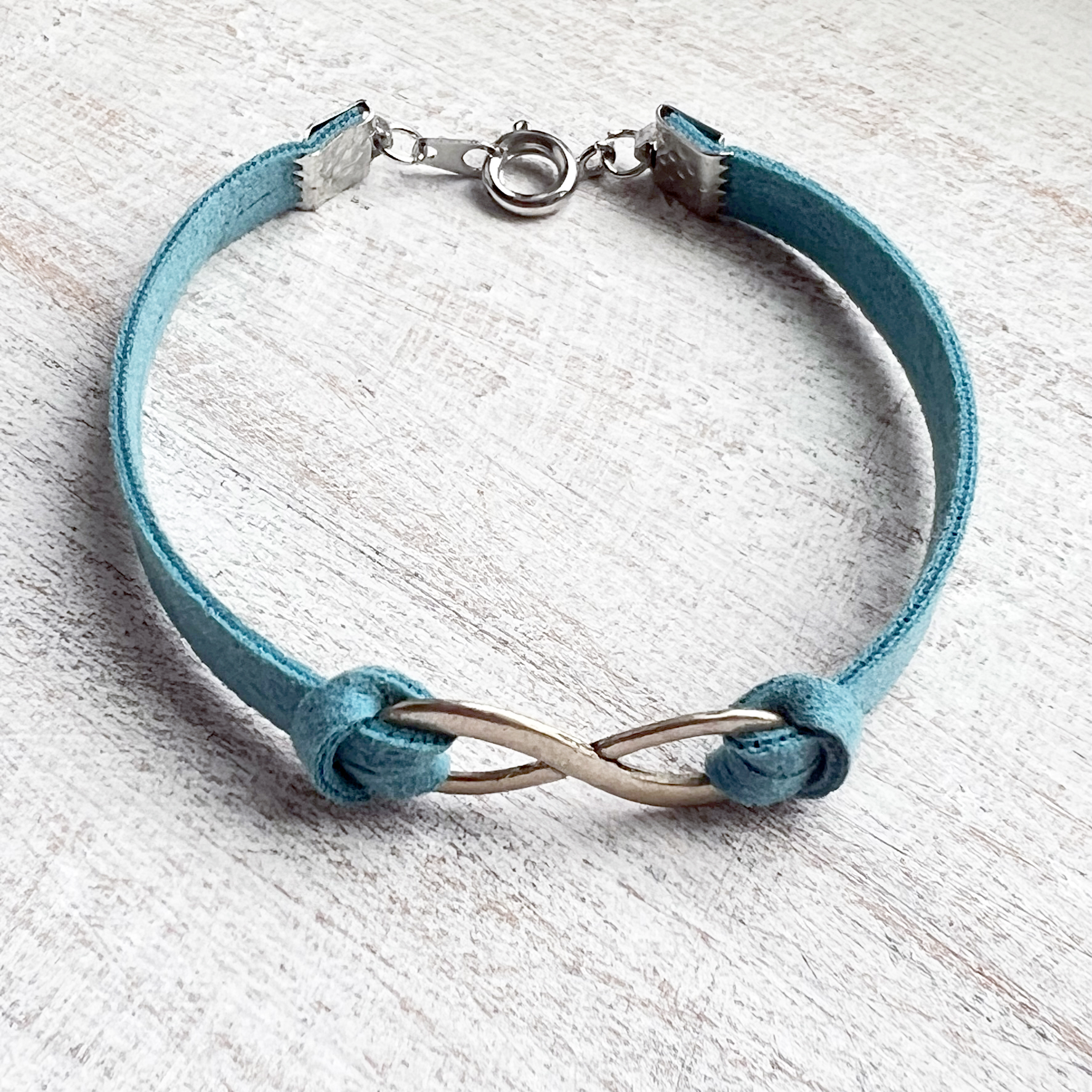 Products :: Teal and Silver Tone Infinity Suede Bracelet